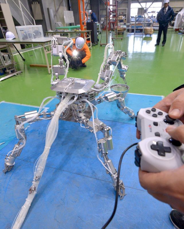 In Photos: Factory unveils 'muscle robots' for Fukushima nuke plant ...