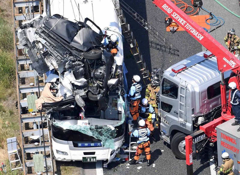 Driver dies after car flies onto top of tourist bus in highway crash ...