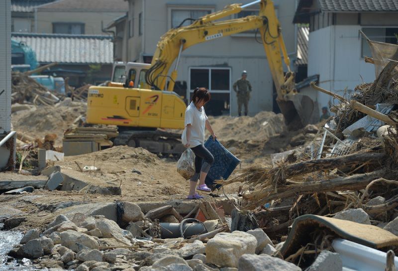 In Photos: Search for missing, cleanup work continues in disaster hit ...