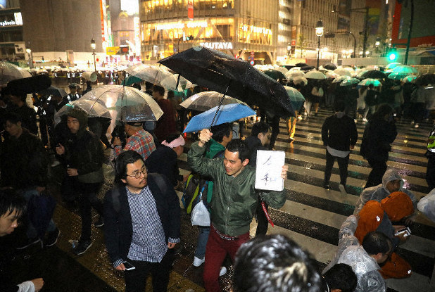 Crowds gather at famous Shibuya crossing as Japan celebrates start of ...