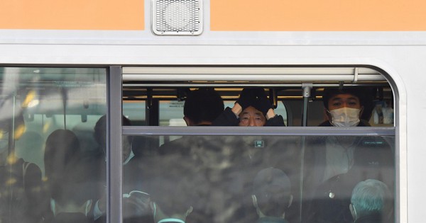 In Photos: Business as usual during Japan's morning rush-hour under ...