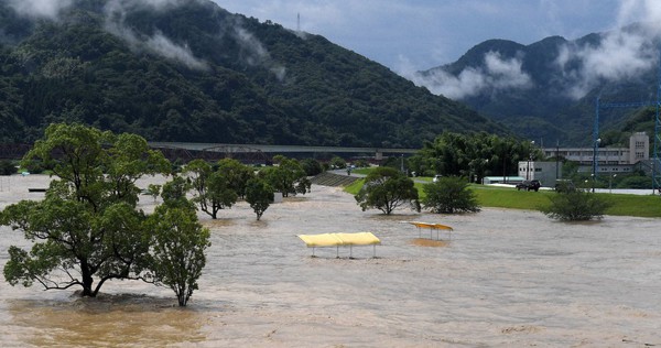 In Photos: Kuma River overflows as record rainfall strikes southwest ...