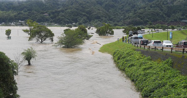 In Photos: Kuma River overflows as record rainfall strikes southwest ...
