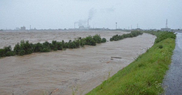In Photos: Kuma River overflows as record rainfall strikes southwest ...