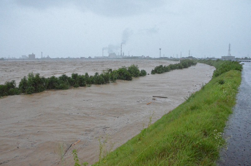 In Photos: Kuma River overflows as record rainfall strikes southwest ...