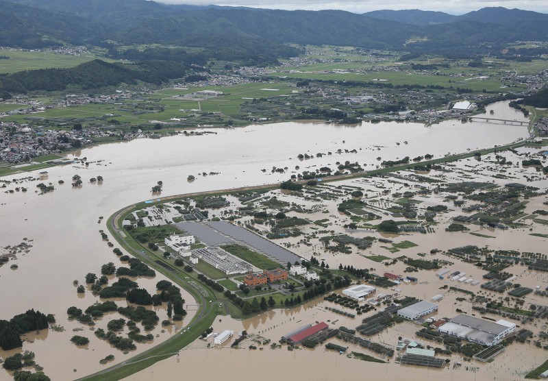 In Photos: Overflowing river in northern Japan floods communities - The ...