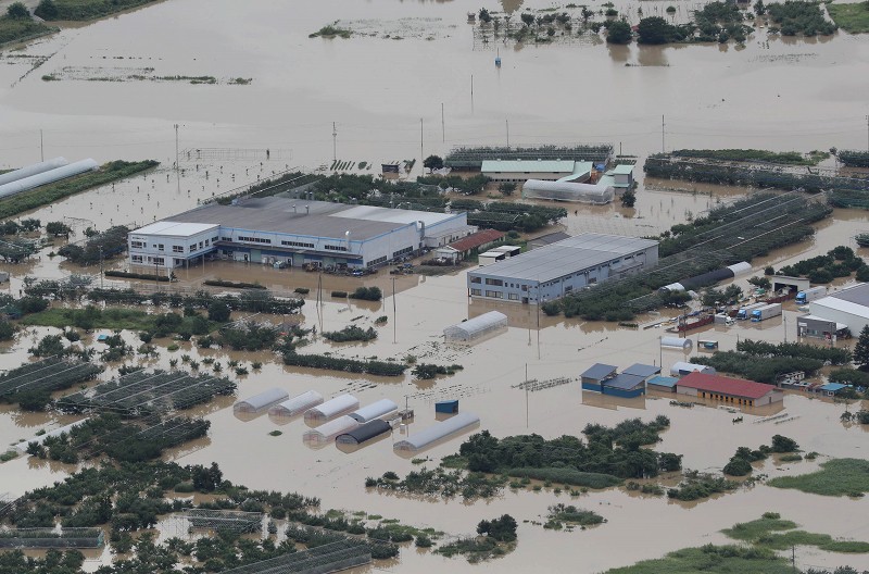 In Photos: Overflowing river in northern Japan floods communities - The ...