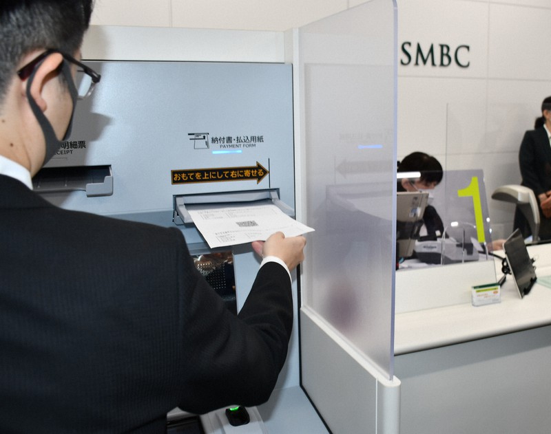 Banks in Japan shifting to ATM-based transactions amid move to avoid ...