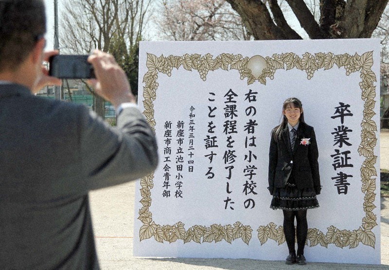 Giant graduation certificates given to schools in Japanese city amid ...