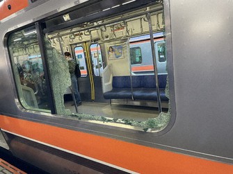 Train makes emergency stop after carriage window shatters in suburban ...