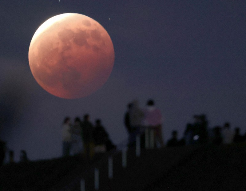 In Photos: Copper moon appears in Japan skies during total lunar ...