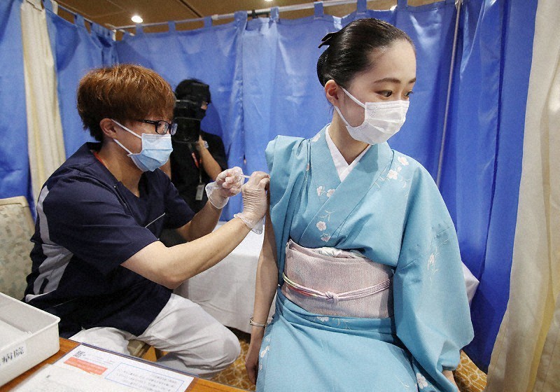 Japan Photo Journal: Hot spring workers get COVID-19 shots ahead of ...