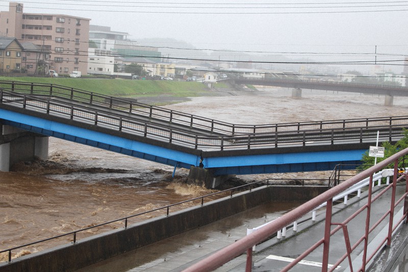 Bridge in central Japan begins V-shaped collapse into rain-swollen ...
