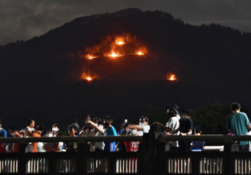 In Photos: Small-scale Kyoto hillside bonfire display held amid ...