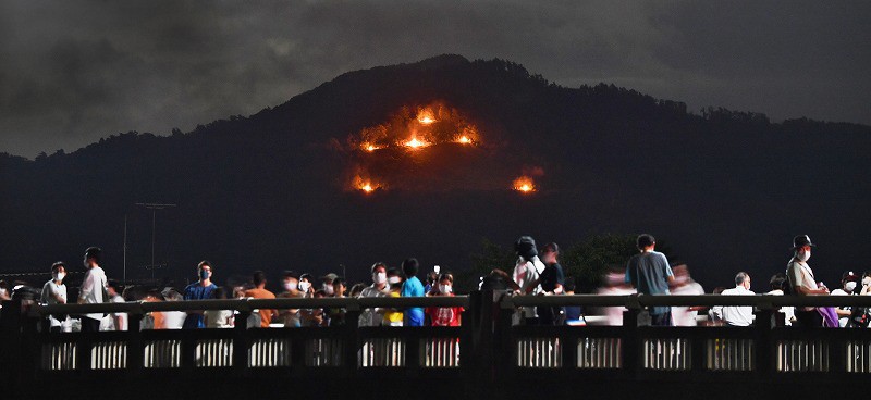 In Photos: Small-scale Kyoto hillside bonfire display held amid ...