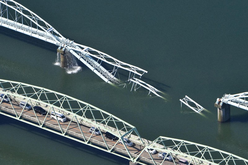 Water pipe bridge collapses in west Japan forcing people to line up for ...