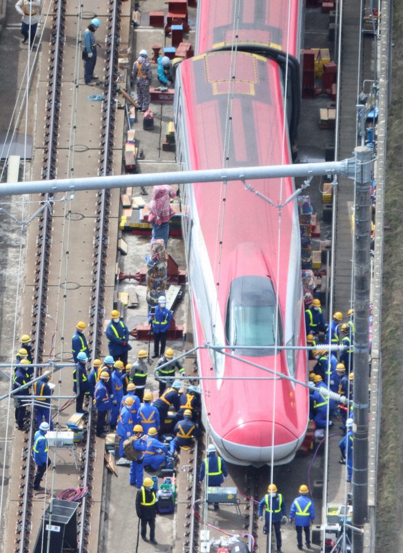 In Photos: Work to remove bullet train derailed by quake commences ...