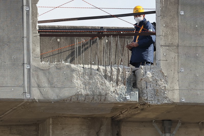 In Photos: Work to remove bullet train derailed by quake commences ...