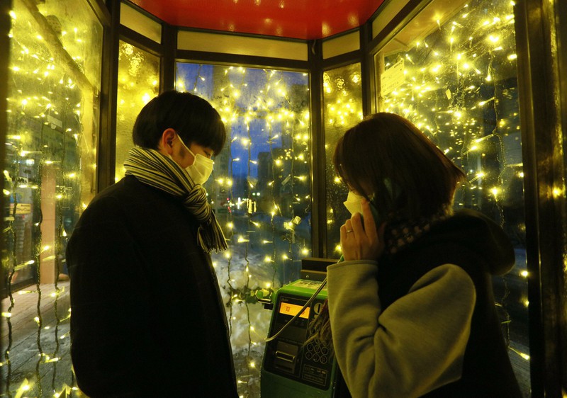 In Photos: Illuminated phone booth adds warmth to street in northeast ...