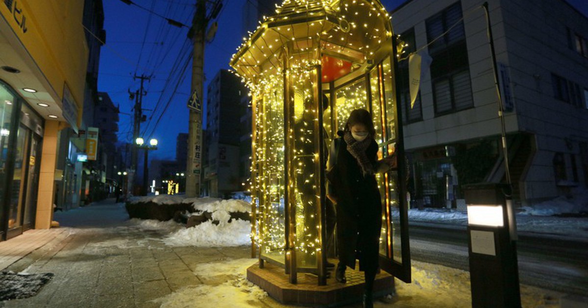 In Photos: Illuminated phone booth adds warmth to street in northeast ...