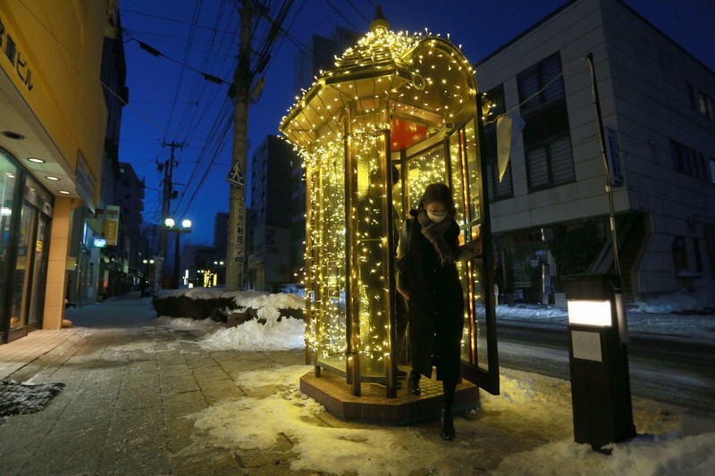 In Photos: Illuminated phone booth adds warmth to street in northeast ...