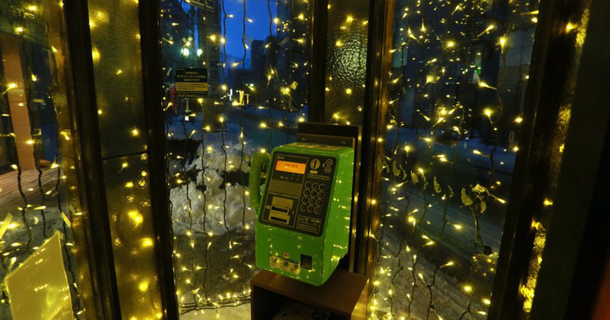 In Photos: Illuminated phone booth adds warmth to street in northeast ...