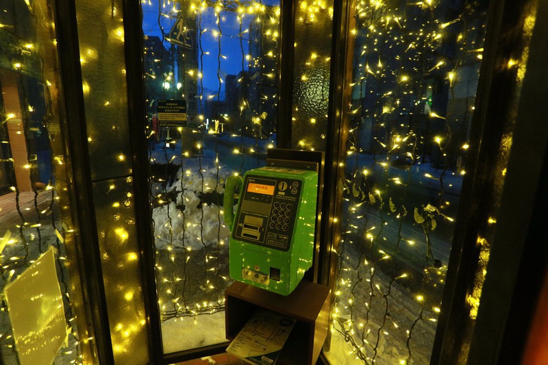 In Photos: Illuminated phone booth adds warmth to street in northeast ...