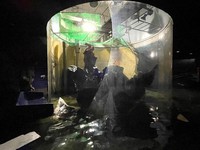 In Photos: Large tank housing giant catfish ruptures at west Japan ...