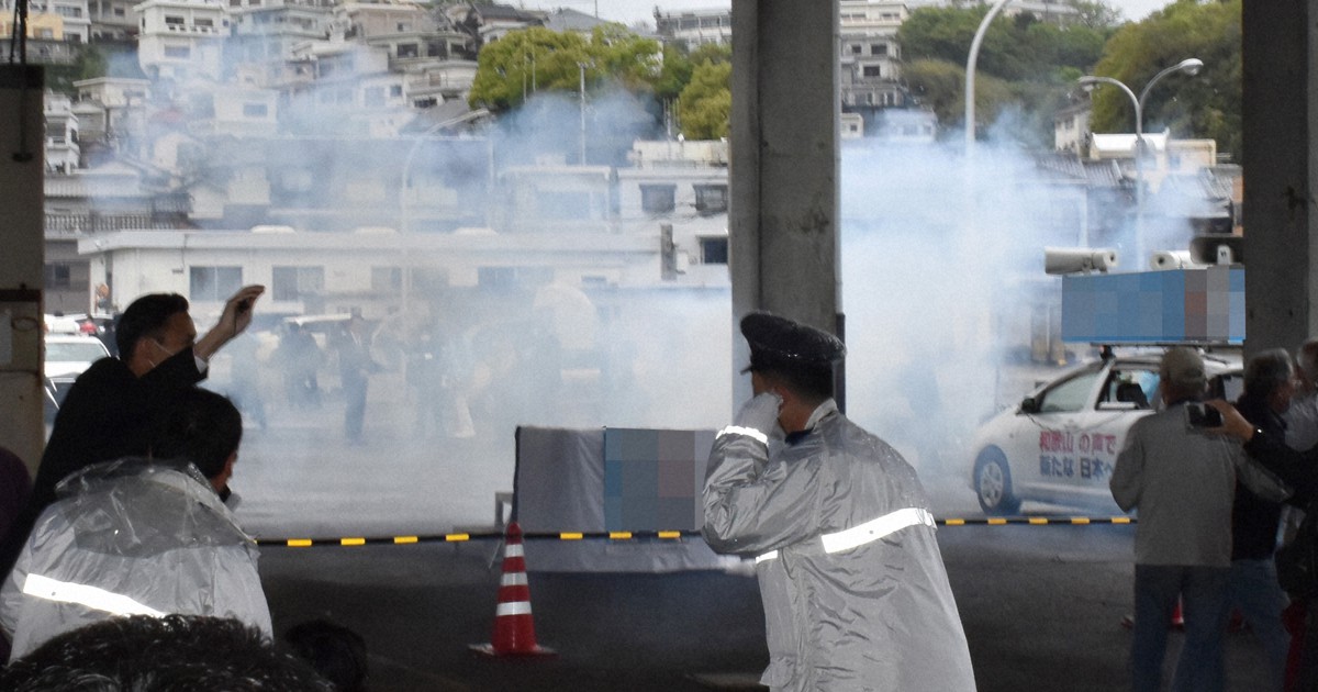 Videos show explosive device rolling near Japan PM, police protecting ...