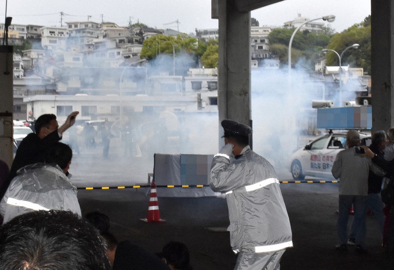 Videos show explosive device rolling near Japan PM, police protecting ...