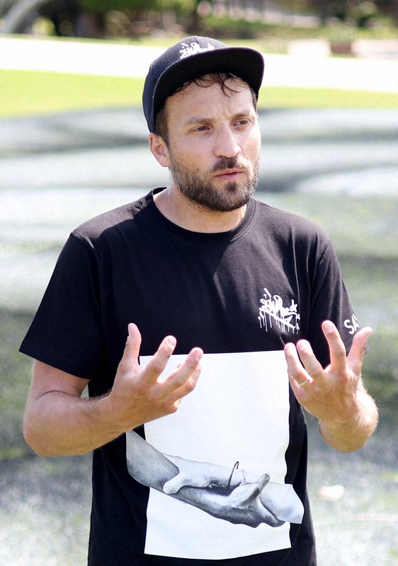 French artist paints giant geoglyph in Okinawa Pref. to express ...