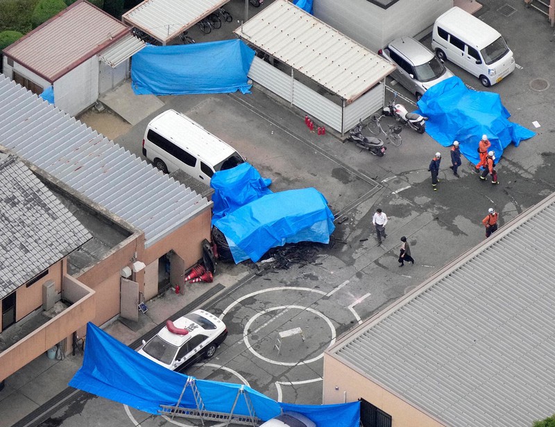 Man dies after crashing into Japan police station parking lot cars ...