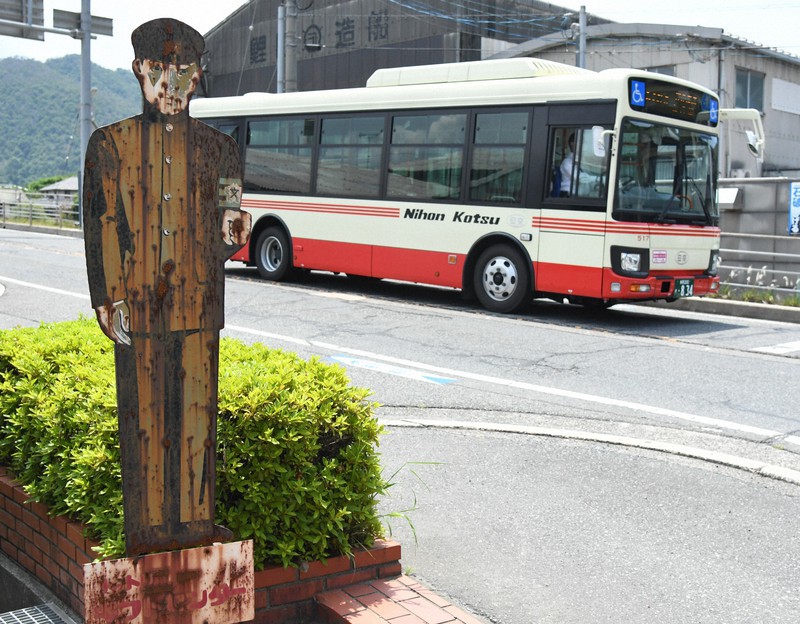 In Photos: Ghostly uniformed figures keep silent watch over west Japan ...