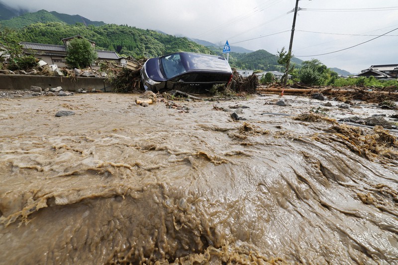 In Photos: Heavy rain causes landslides, flooding, transport snarls in ...