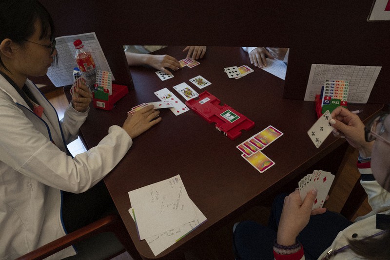 The centuries-old card game of bridge offers a sharp contrast to ...