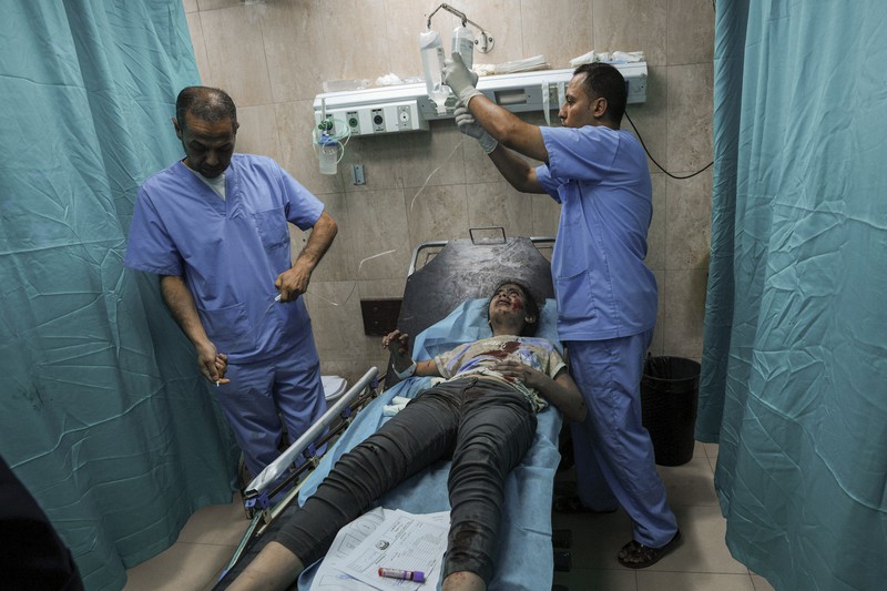 Gaza hospitals are overwhelmed with patients and desperately low on ...