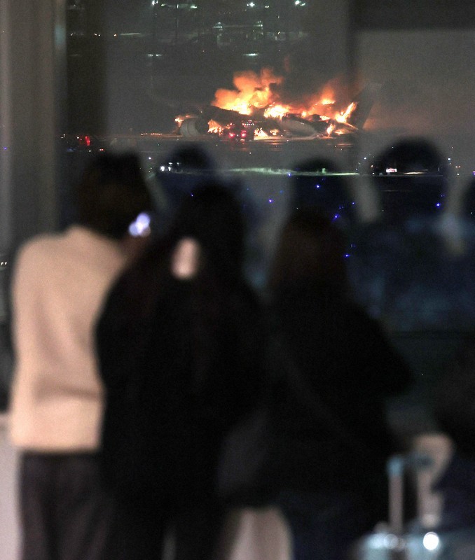 In Photos: Japan Airlines plane catches fire after collision at Tokyo's ...