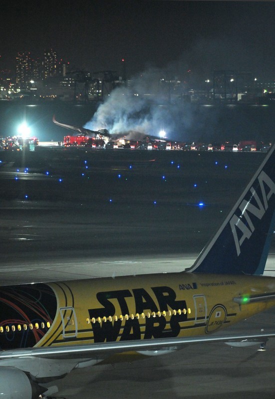 In Photos: Japan Airlines plane catches fire after collision at Tokyo's ...