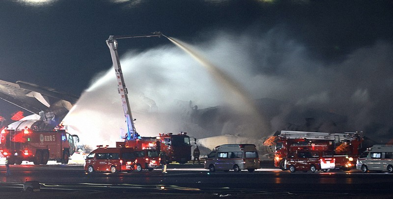 In Photos: Japan Airlines plane catches fire after collision at Tokyo's ...