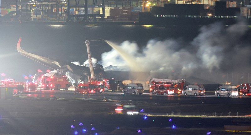 In Photos: Japan Airlines plane catches fire after collision at Tokyo's ...