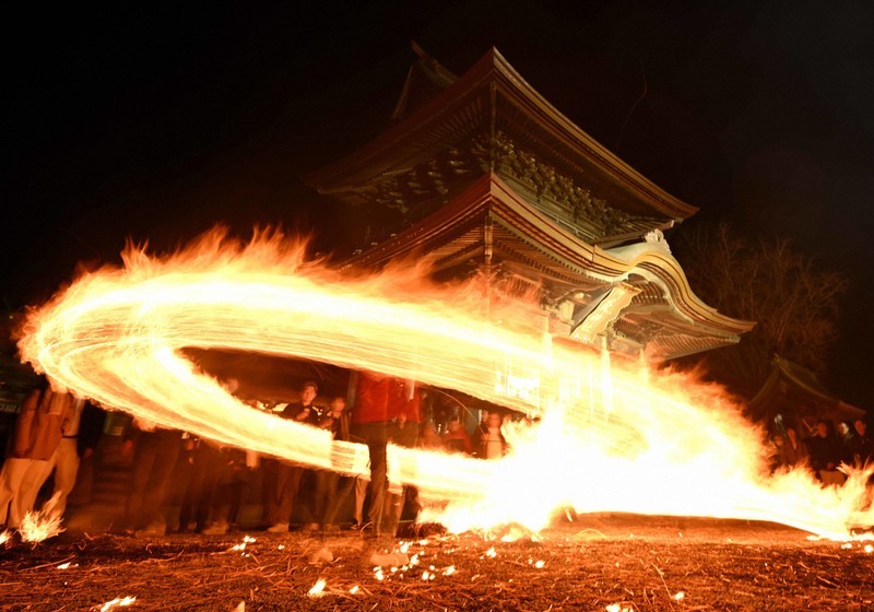 In Photos: Rings of fire spun at southwest Japan shrine to pray for ...