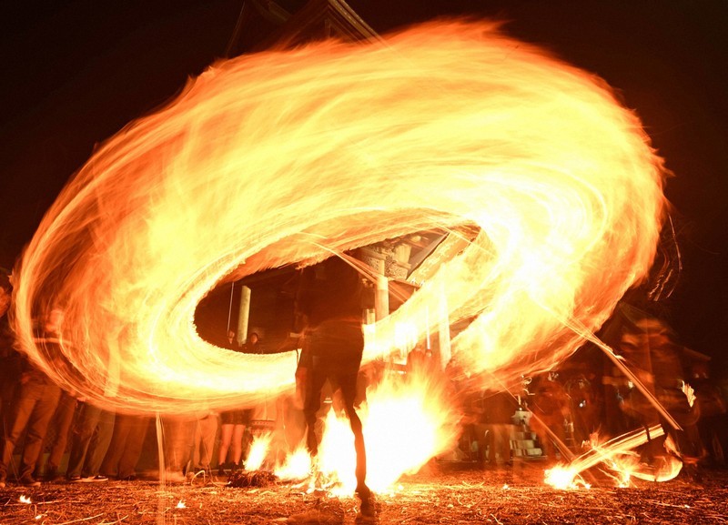 In Photos: Rings of fire spun at southwest Japan shrine to pray for ...