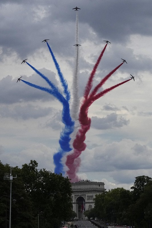 France's Bastille Day parade meets the Olympic torch relay in an ...