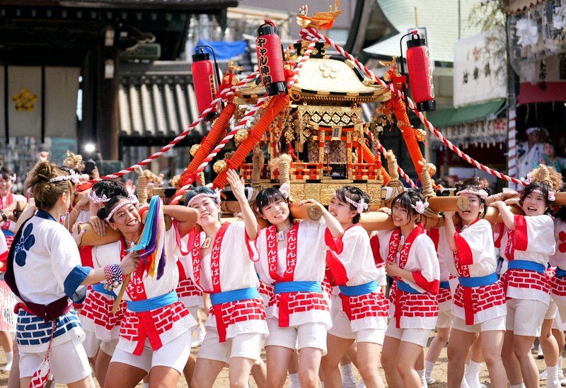 In Photos: Women vigorously carry portable shrines for Osaka summer ...