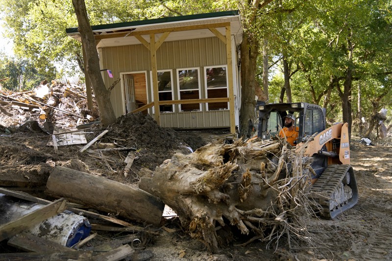 Death toll from Hurricane Helene rises to 227 as grim task of ...