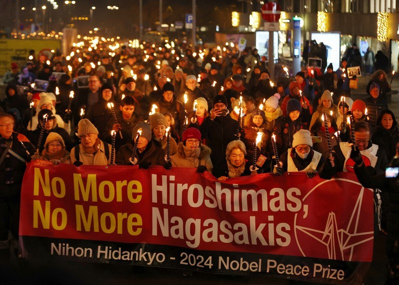 In Photos: Nobel Peace Prize torchlight procession honors Japan A-bomb ...