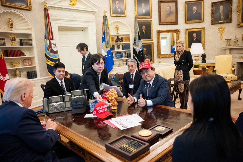 Japanese minister says no political message behind MAGA cap photo - The ...